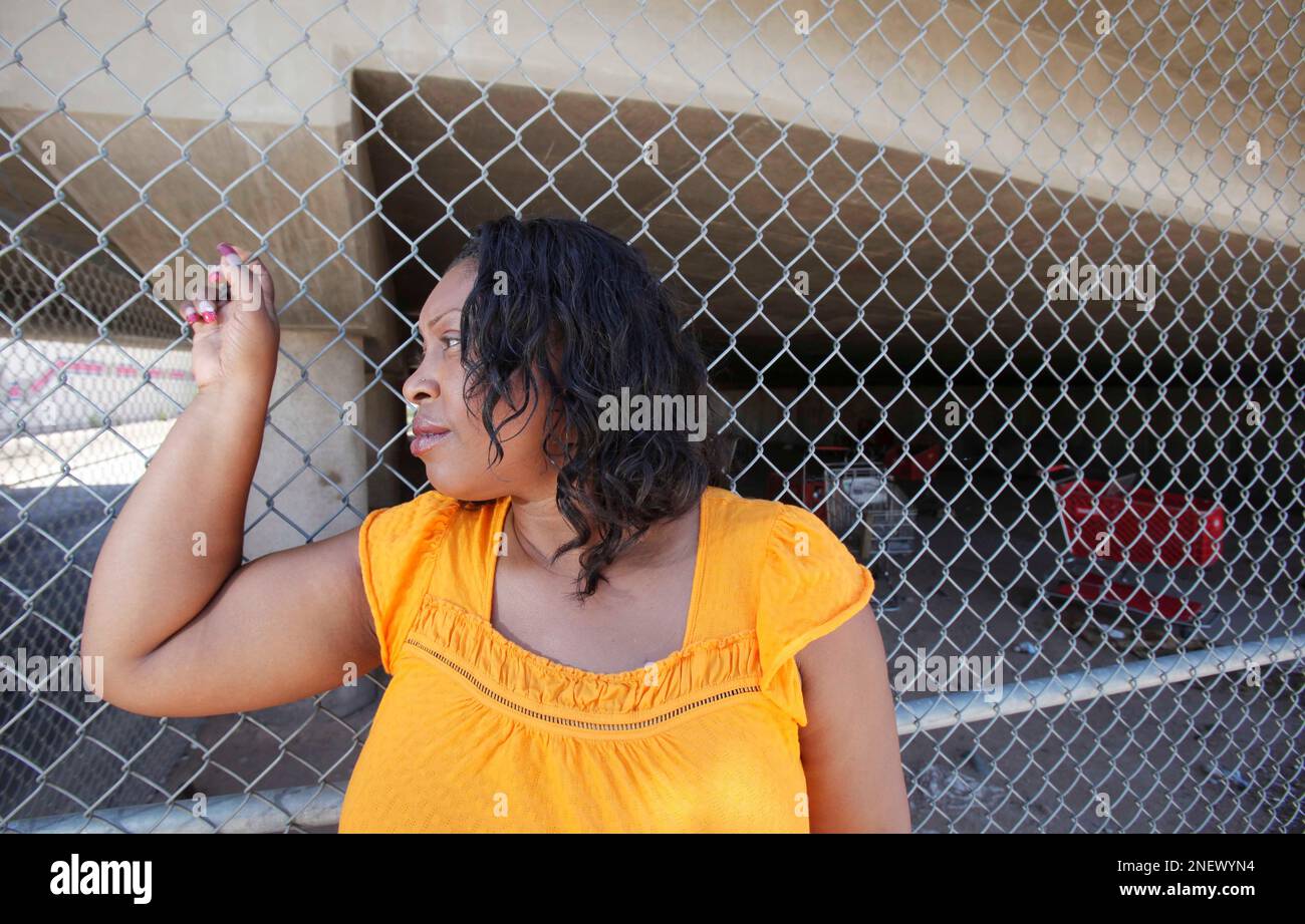 Standing in front of a bridge overpass where she used to sleep on the ...