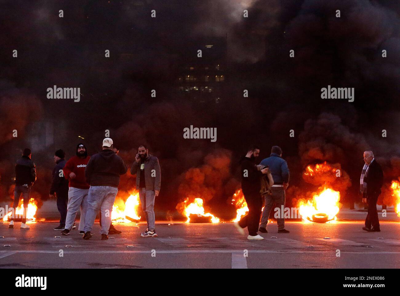 Beirut, Lebanon. 16th Feb, 2023. People block a road with burning tires ...