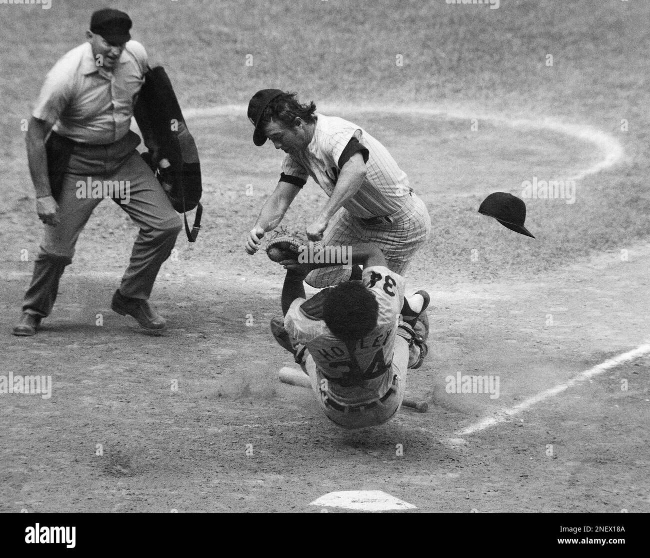 Bobby Murcer of the New York Yankees collides with Tim Hosley, rookie ...