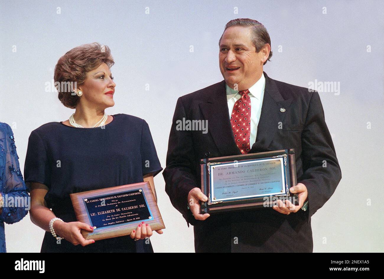 El Salvador President Armando Calderon Sol and his wife Elizabeth hold ...