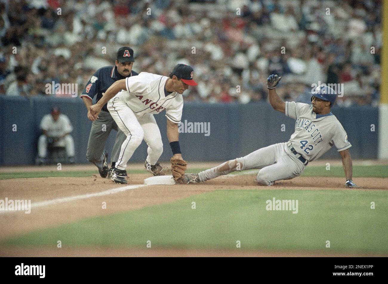 Kansas City Royals centerfielder Tom Goodwin steals third under the tag ...