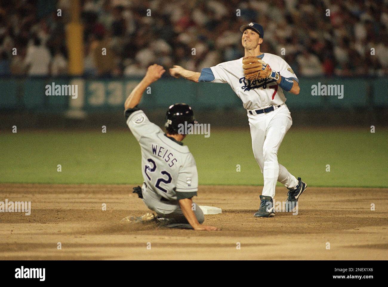 Los Angeles Dodgers shortstop Greg Gagne attempts to convert a double ...
