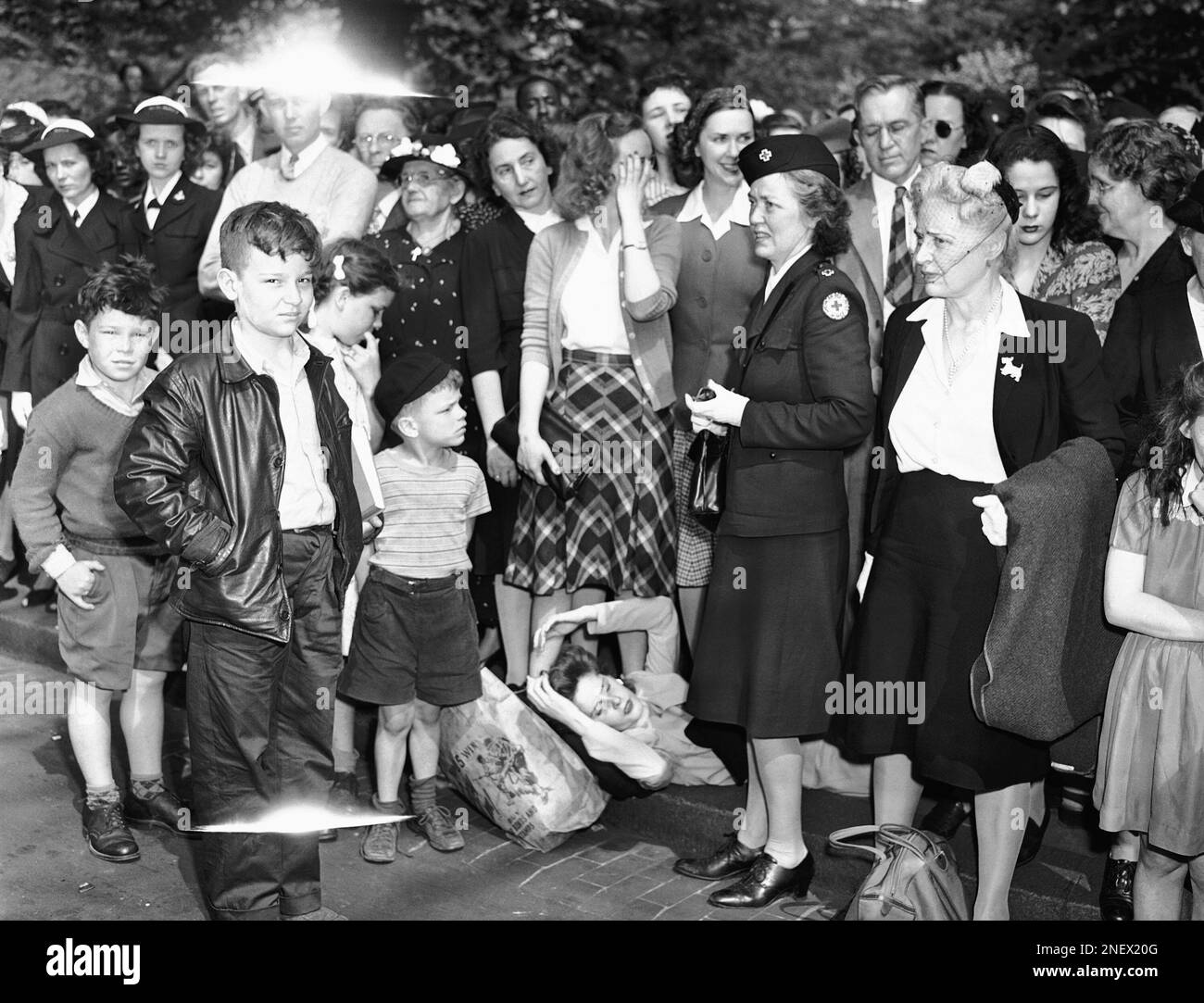 Overcome as she watched the passing of the military cortege bearing the ...