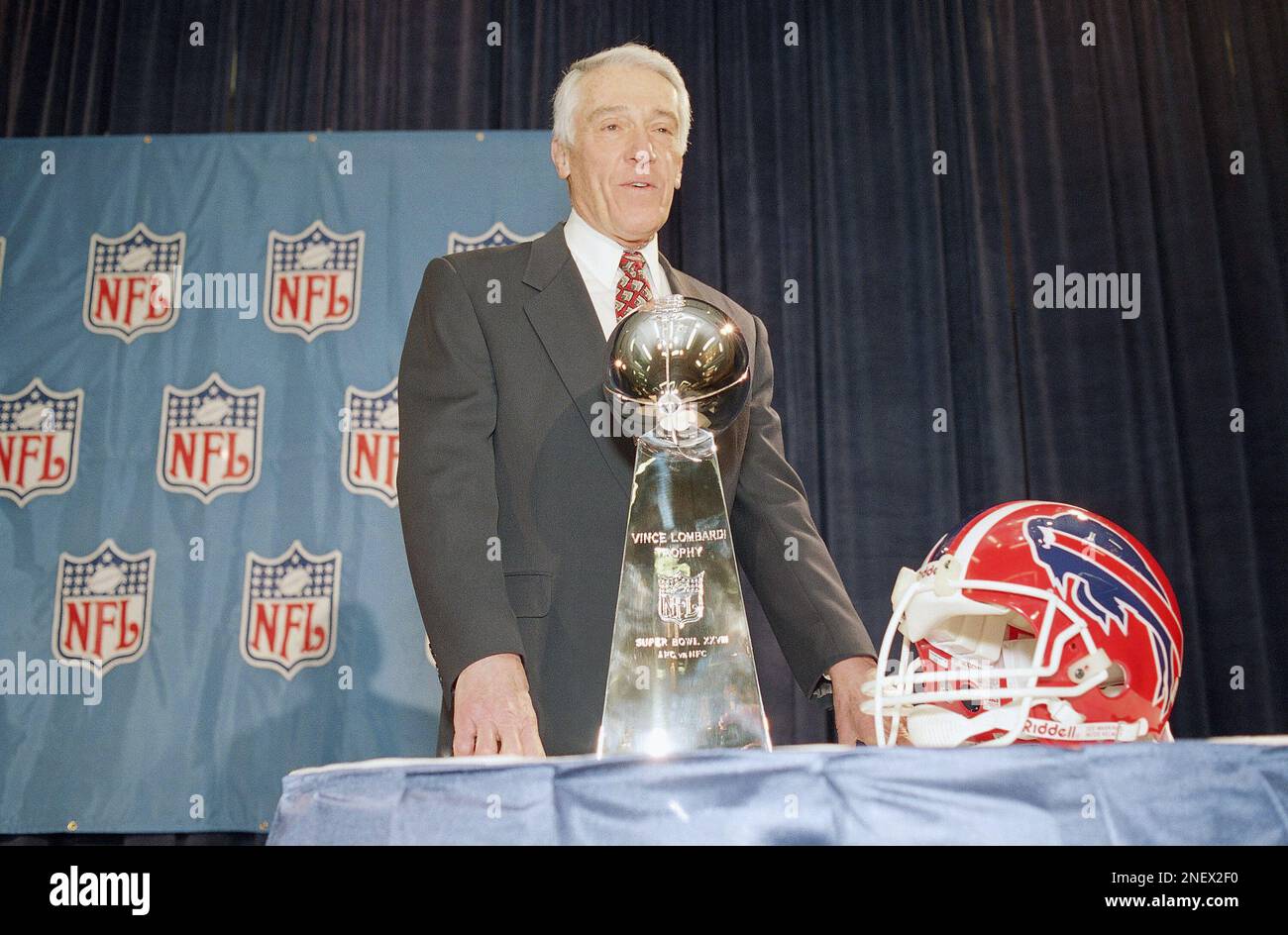 Buffalo Bills coach Marv Levy poses with the Super Bowl trophy and a ...
