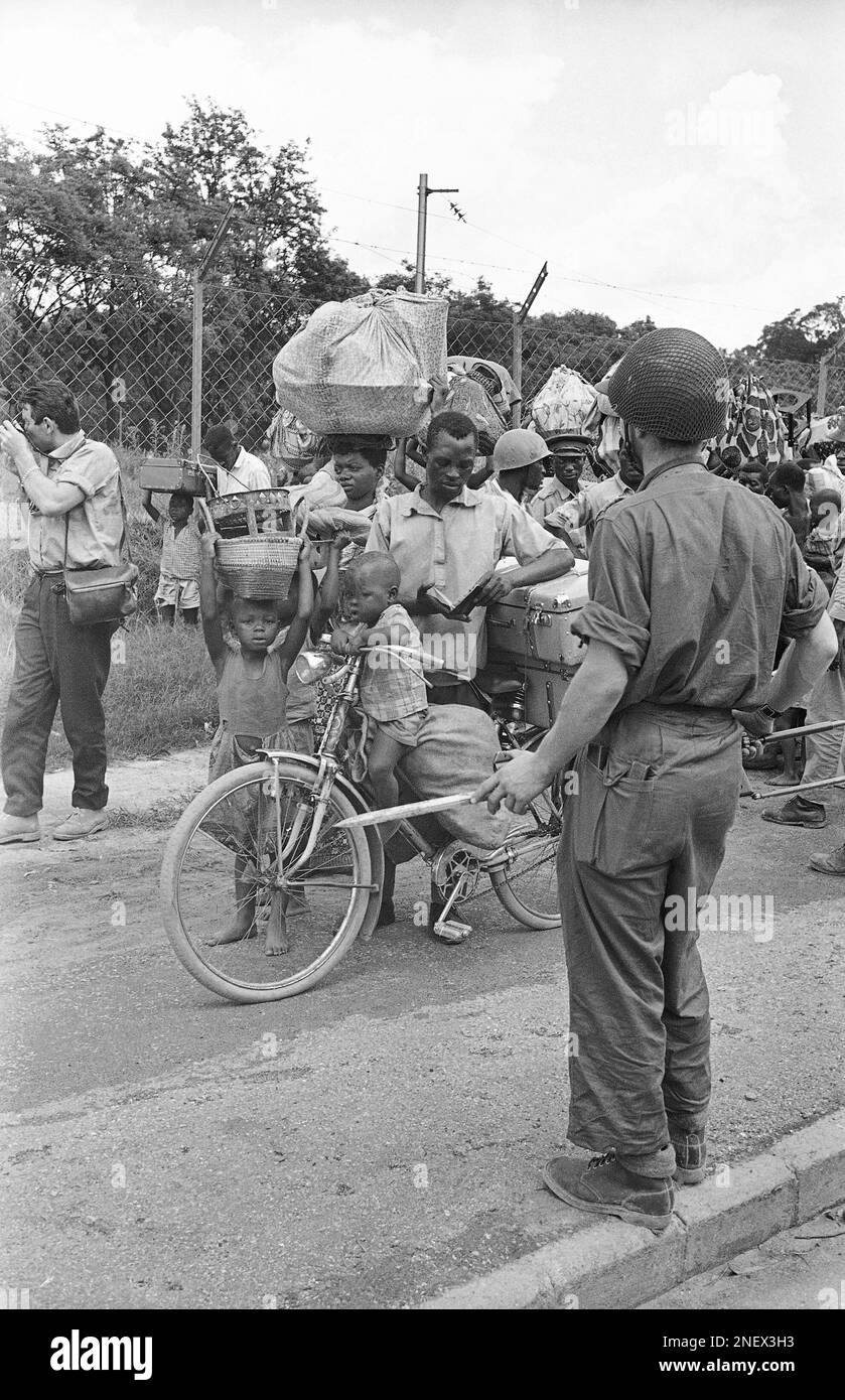 Swedish troops of the United Nations hold back Baluba refugees at a ...