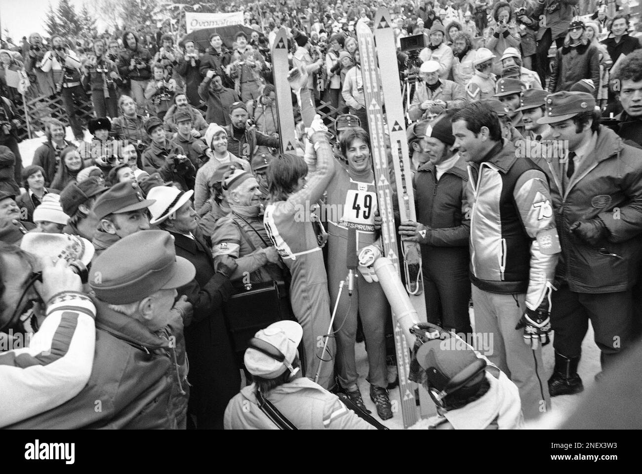 Austria’s Karl Schnabl, right, waves to cheering crowd, Sunday, Feb. 15 ...