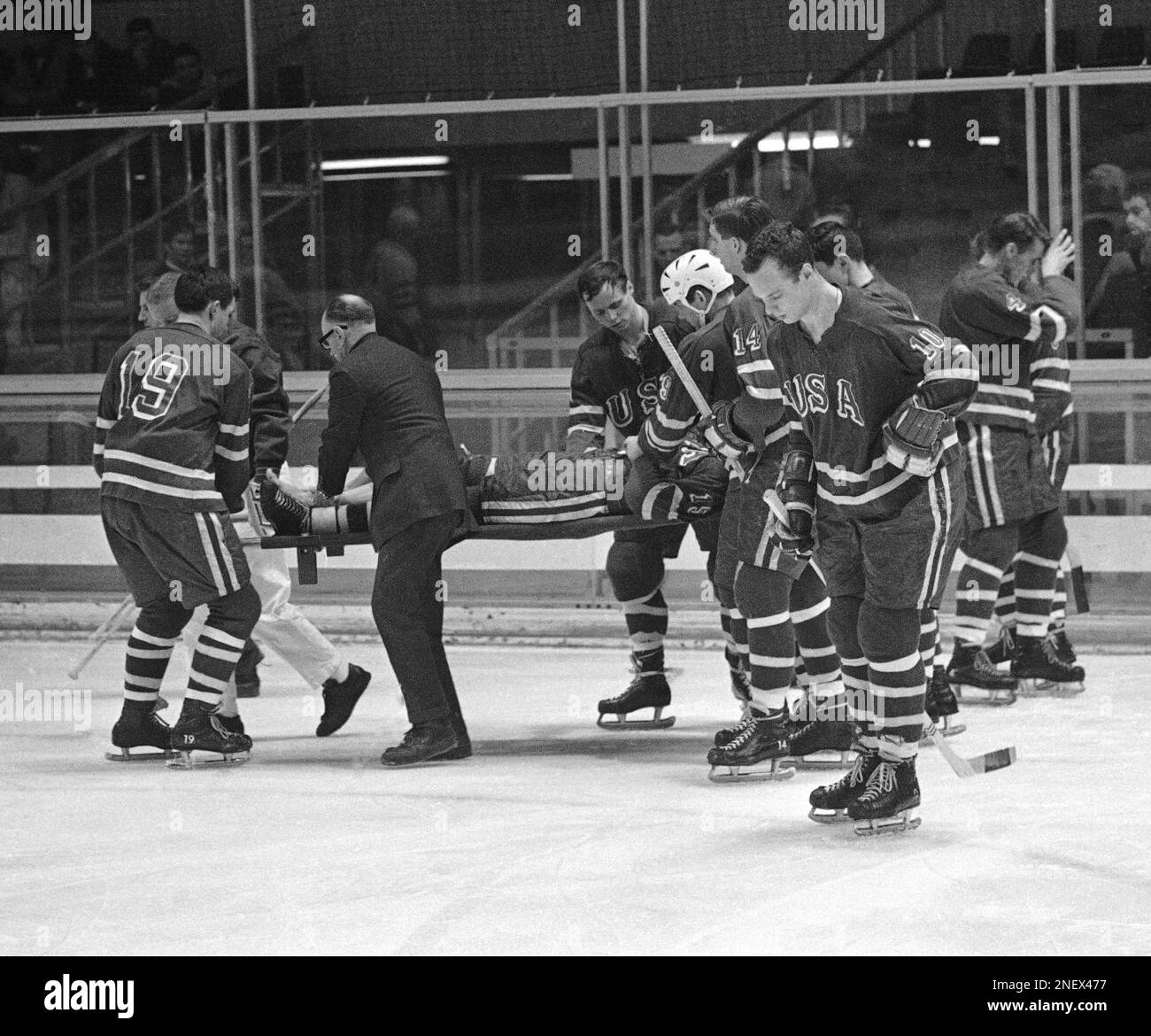 Craig Falkman of Minnesota is carried off the ice after dislocating his ...