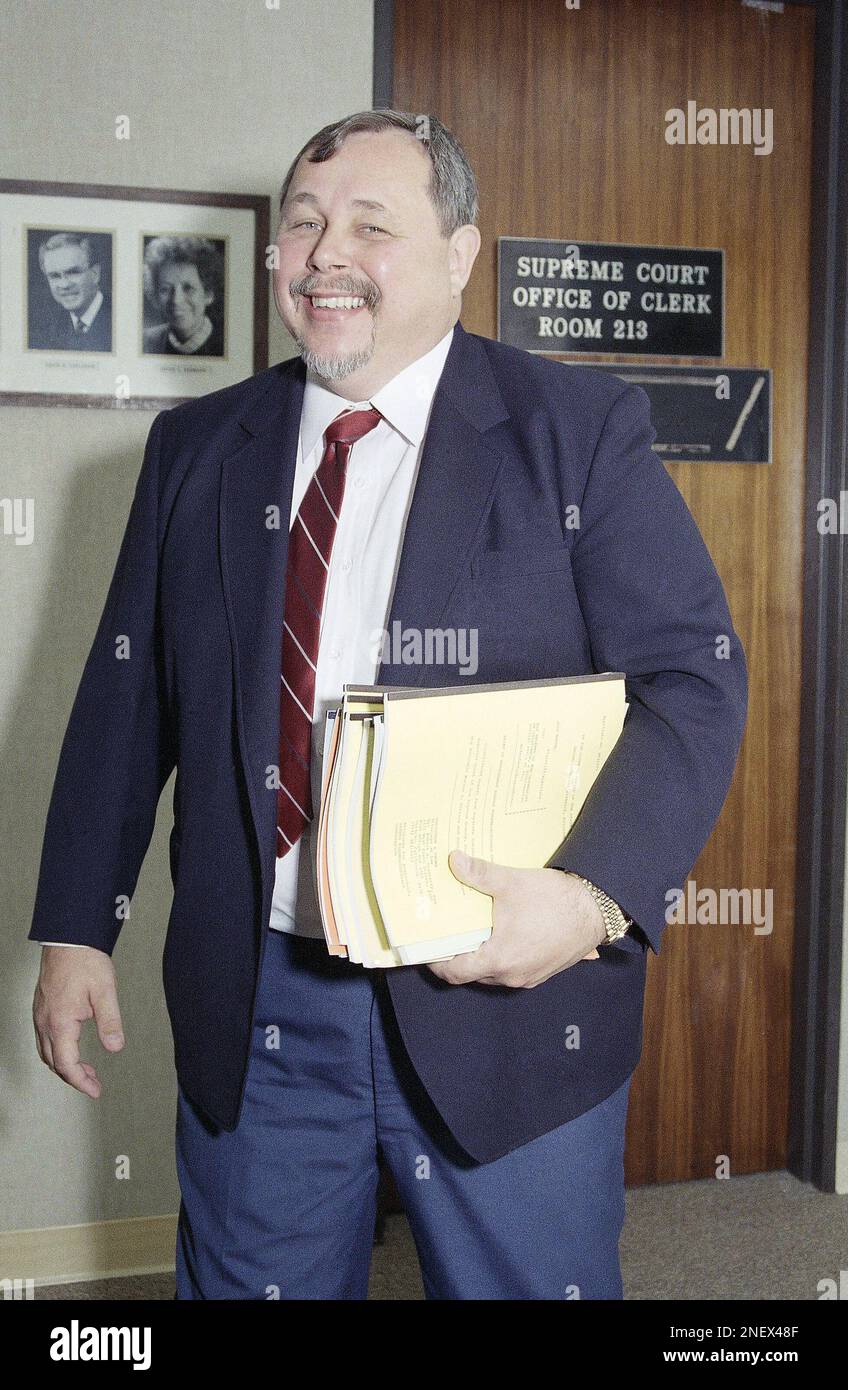 John Moore, a cancer patient from Seattle, arrives at the offices of ...
