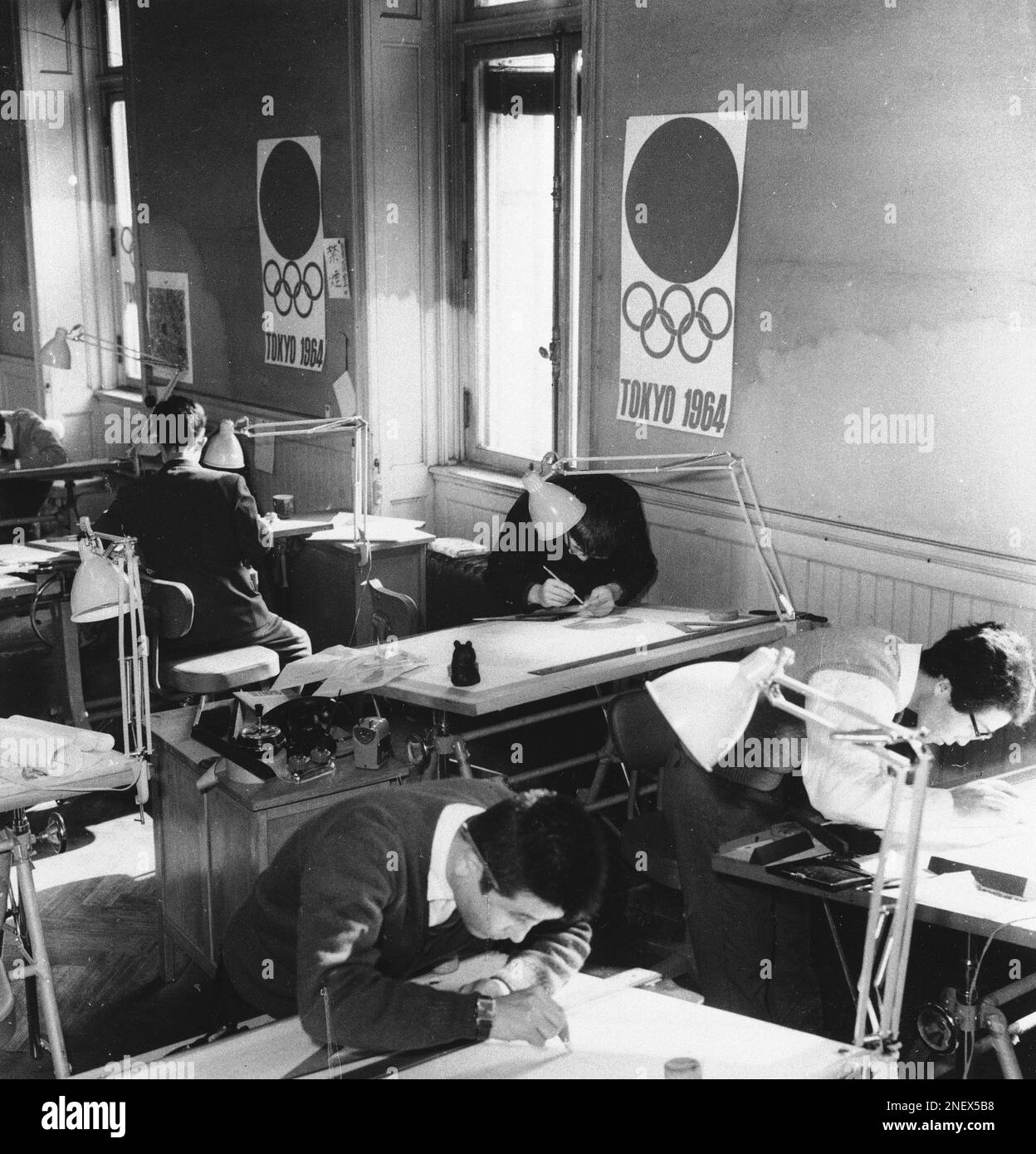 Engineers work on blueprints of the 1964 Tokyo Olympic project in a ...