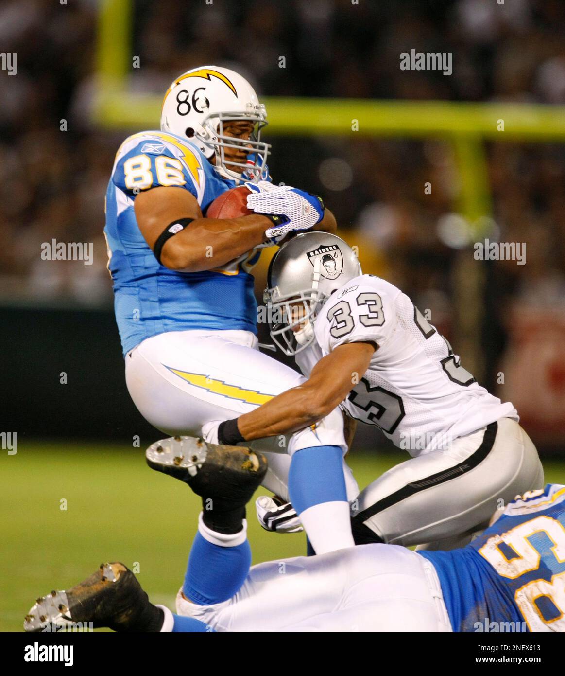San Diego Chargers tight end Brandon Manumaleuna, left, is brought down ...