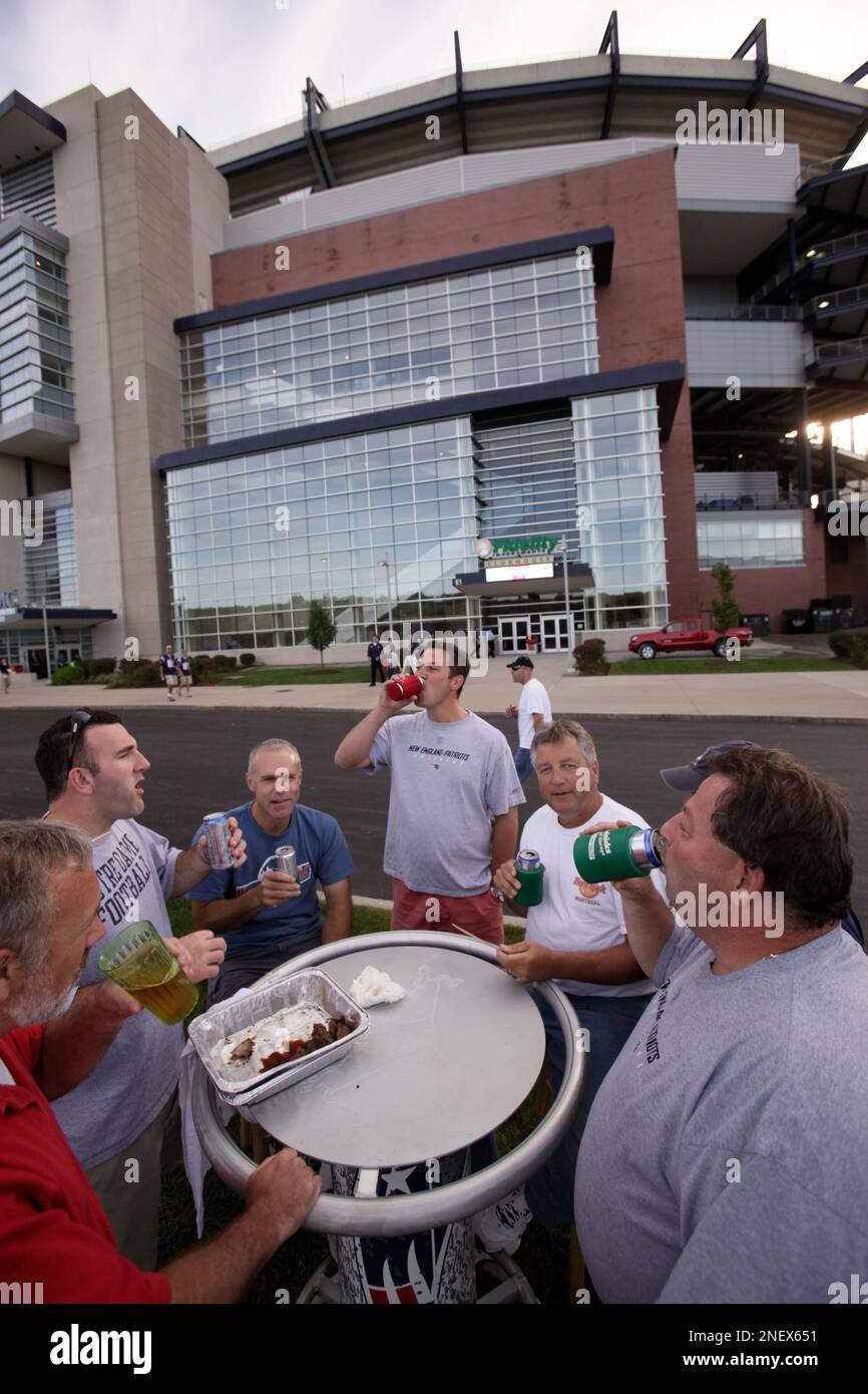 Fans tailgate outside Gillette Stadium before an NFL football game ...