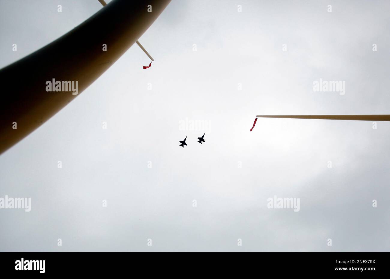 Military jets perform a fly over before the start of an NCAA college ...