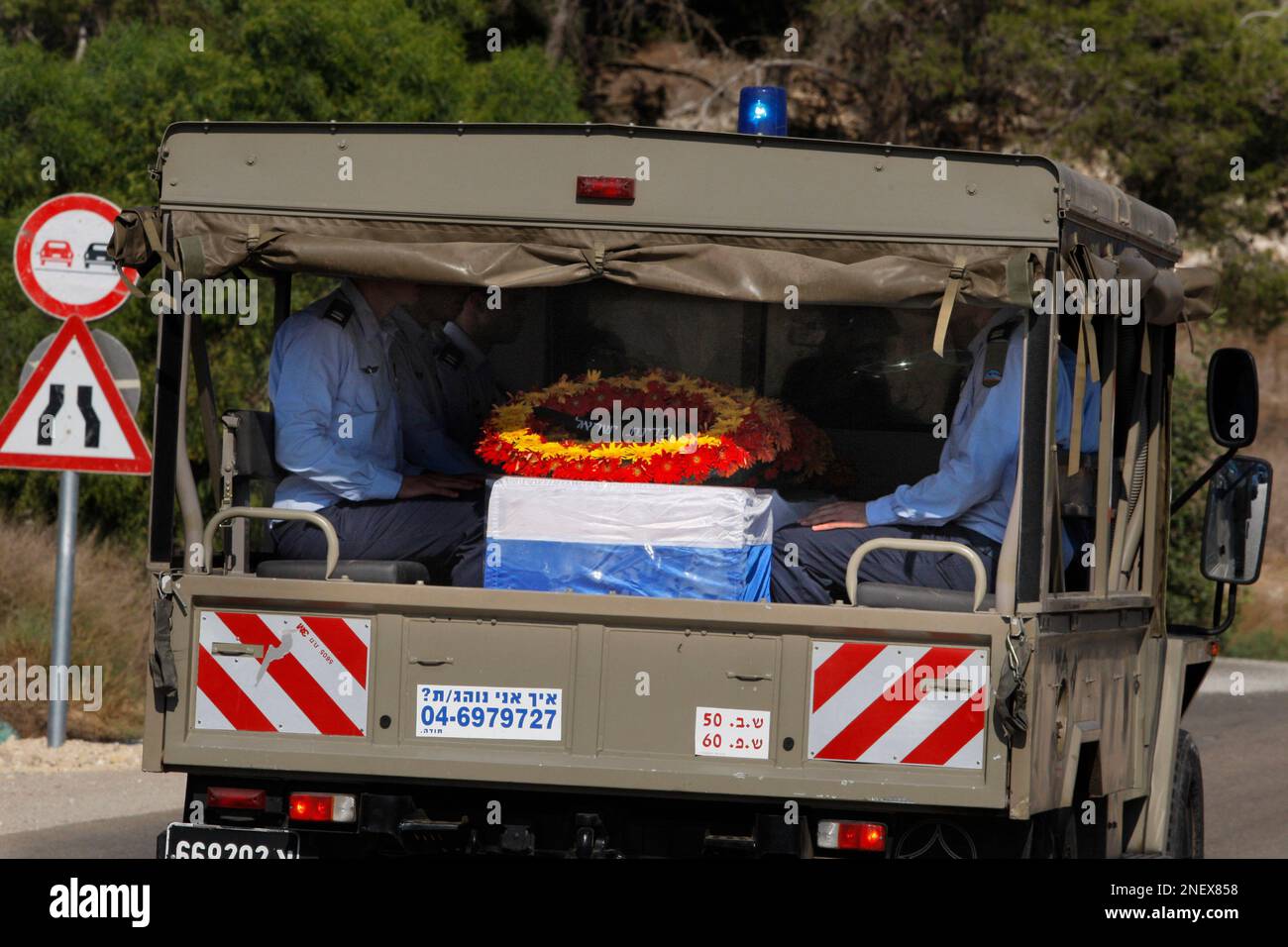 A military vehicle transports the coffin of Capt. Assaf Ramon, killed ...