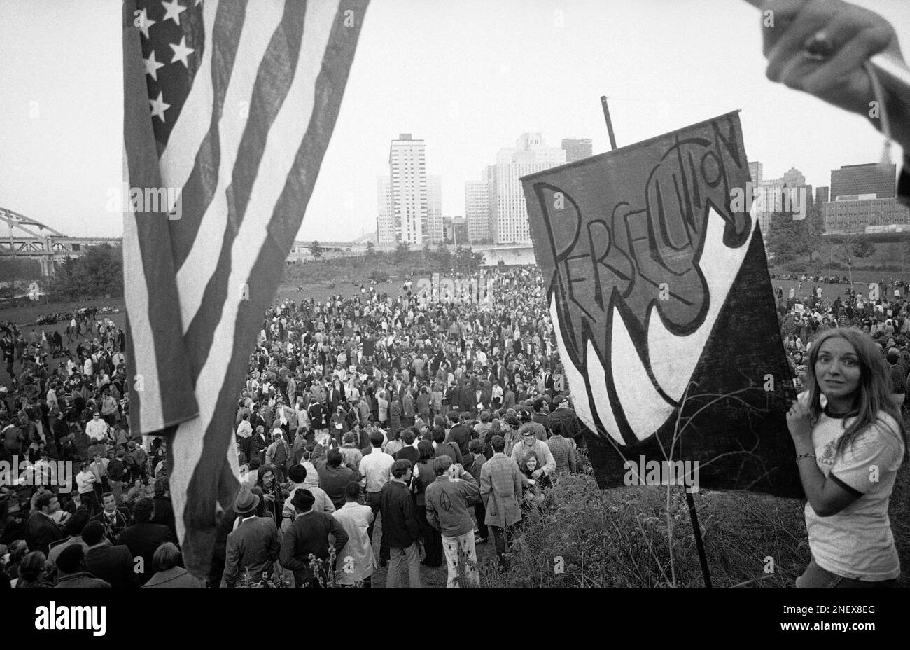 Opponents of the war in Vietnam massed in protest in a crowd, estimated ...