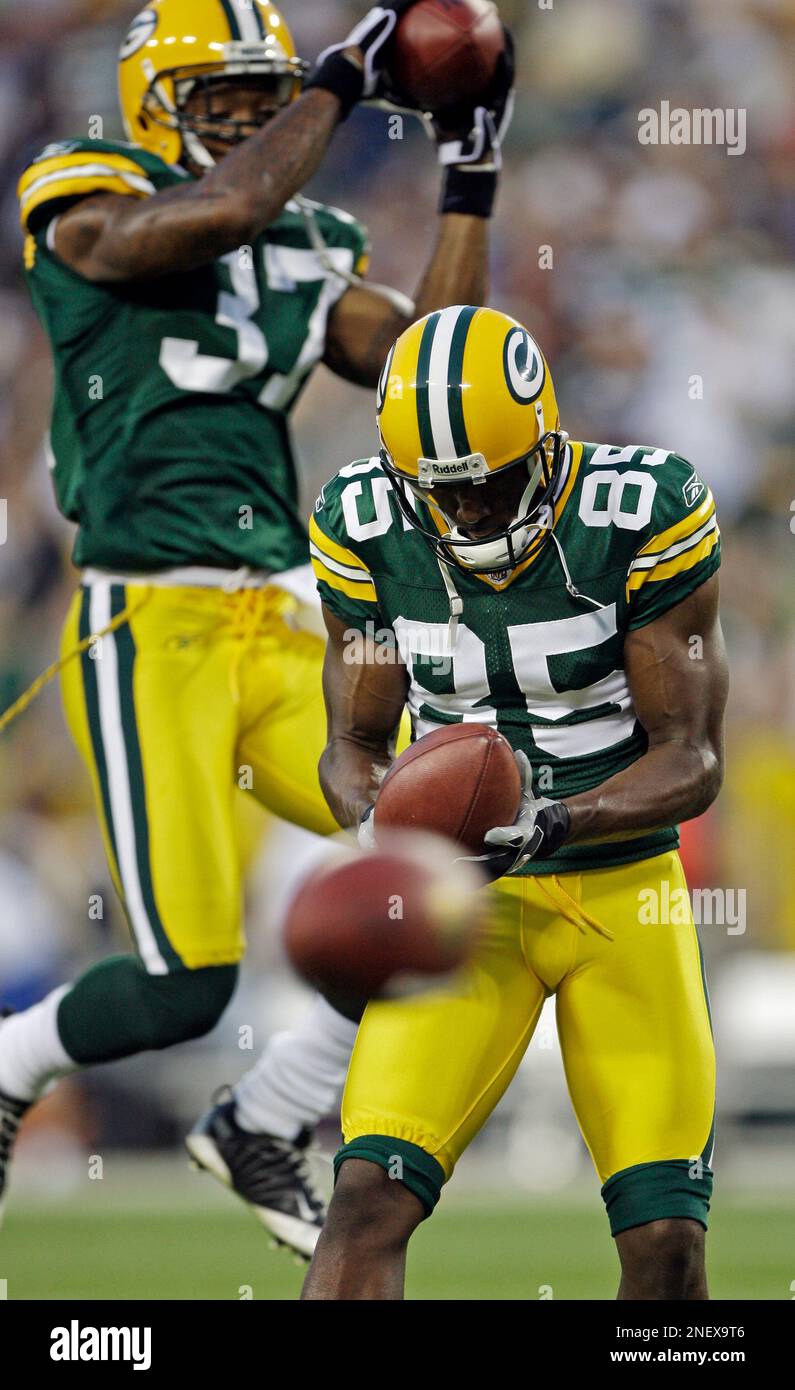 Green Bay Packers wide receiver Greg Jennings (85) an Aaron Rouse (37 ...