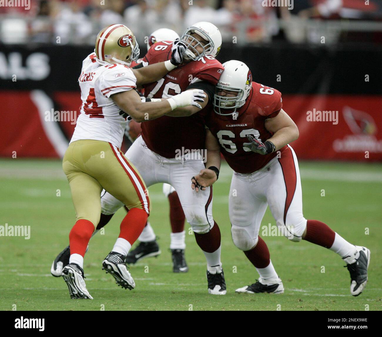 Arizona Cardinals guard Deuce Lutui and teamamte Lyle Sendlein (63) are ...