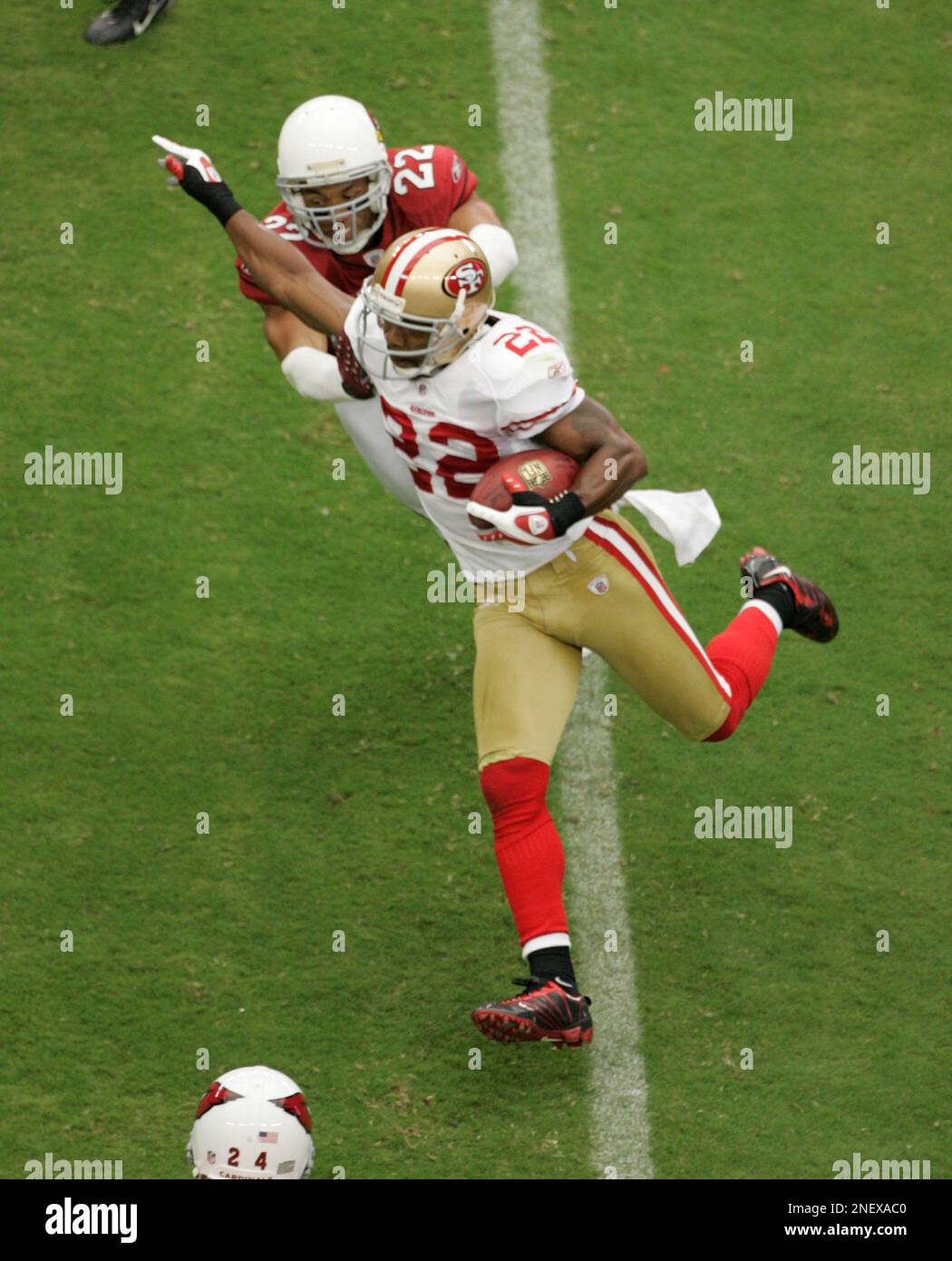 San Francisco 49ers cornerback Nate Clements, front, picks up yards as ...