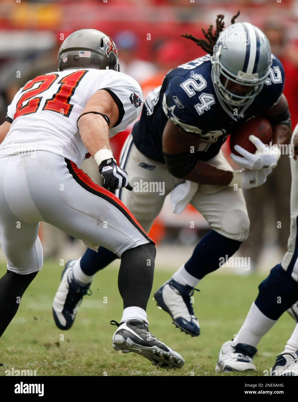 Dallas Cowboys' Marion Barber (24) finds a hole against Tampa Bay's ...