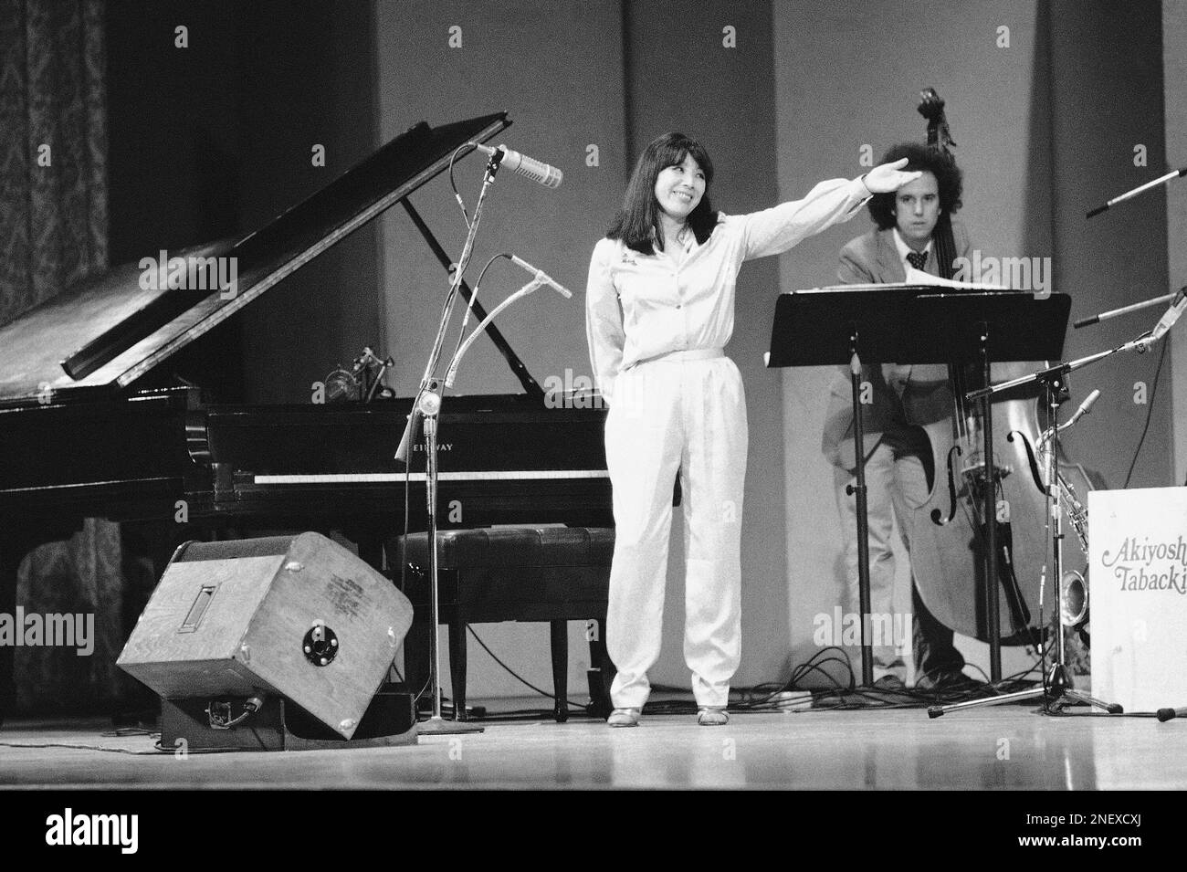 Toshiko Akiyoshi gestures toward her band members after performance ...