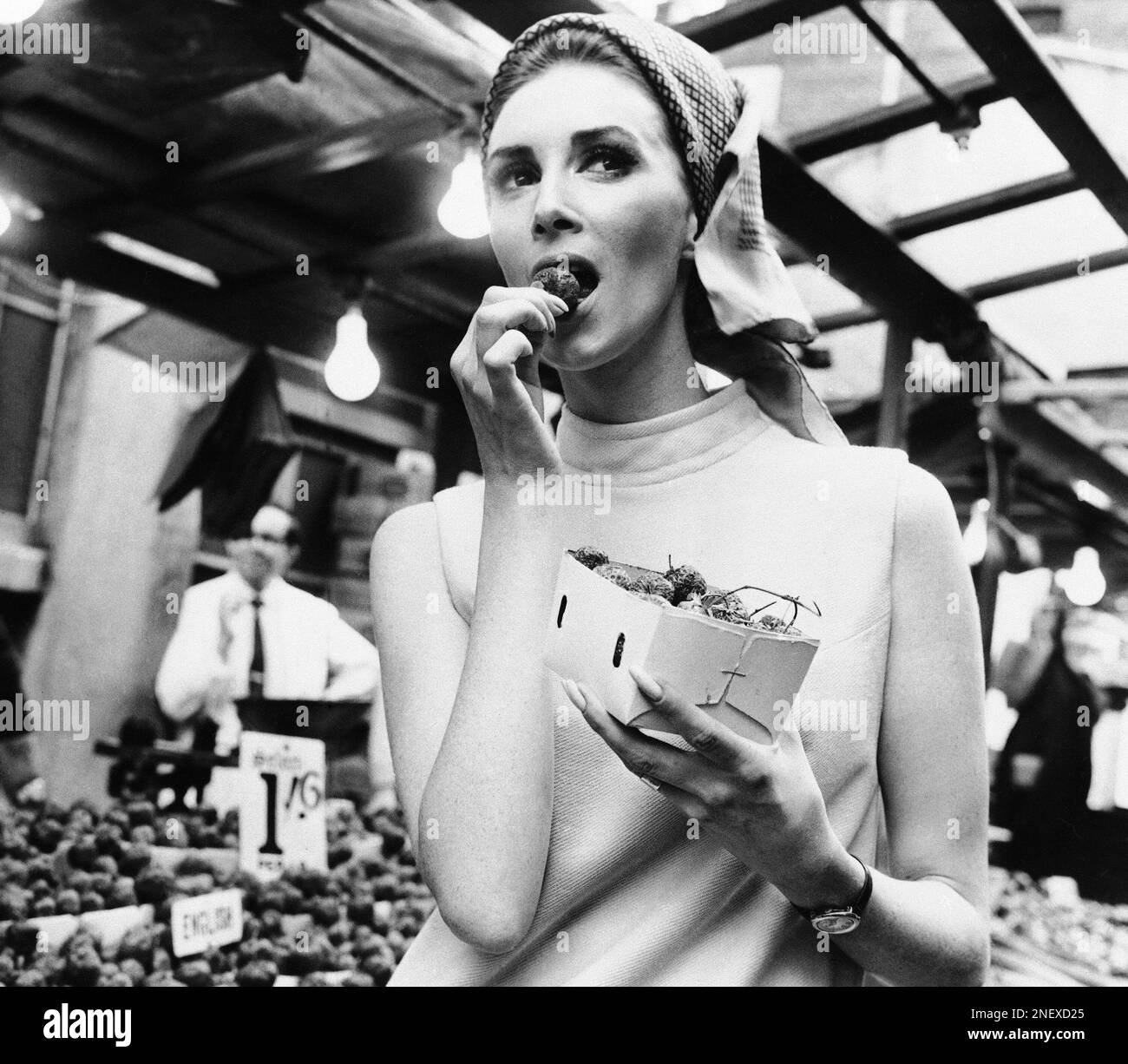 United States model Wilhelmina eats strawberries while wandering ...