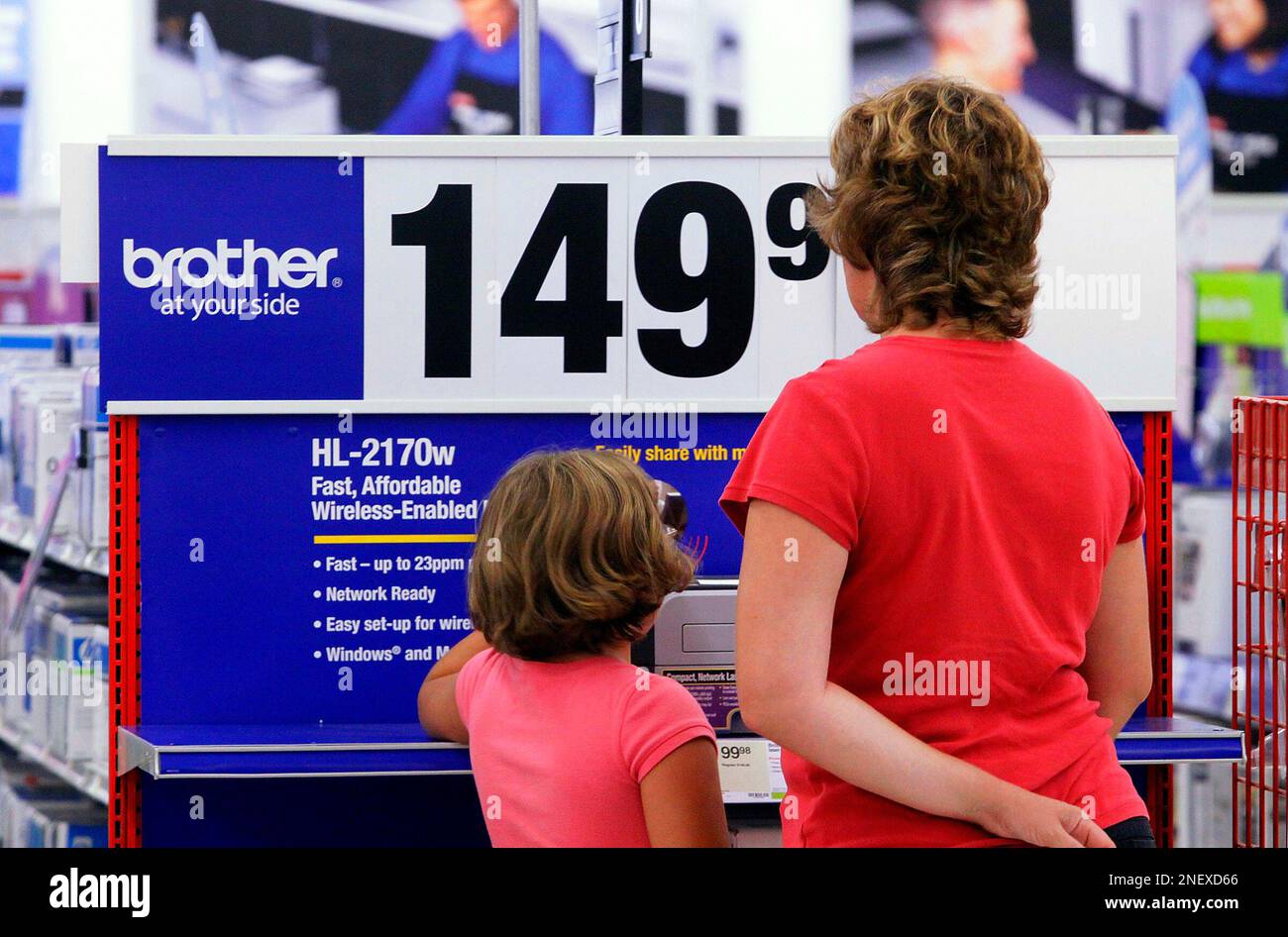 In this photo taken Monday, Aug. 24, 2009, parents, children and ...