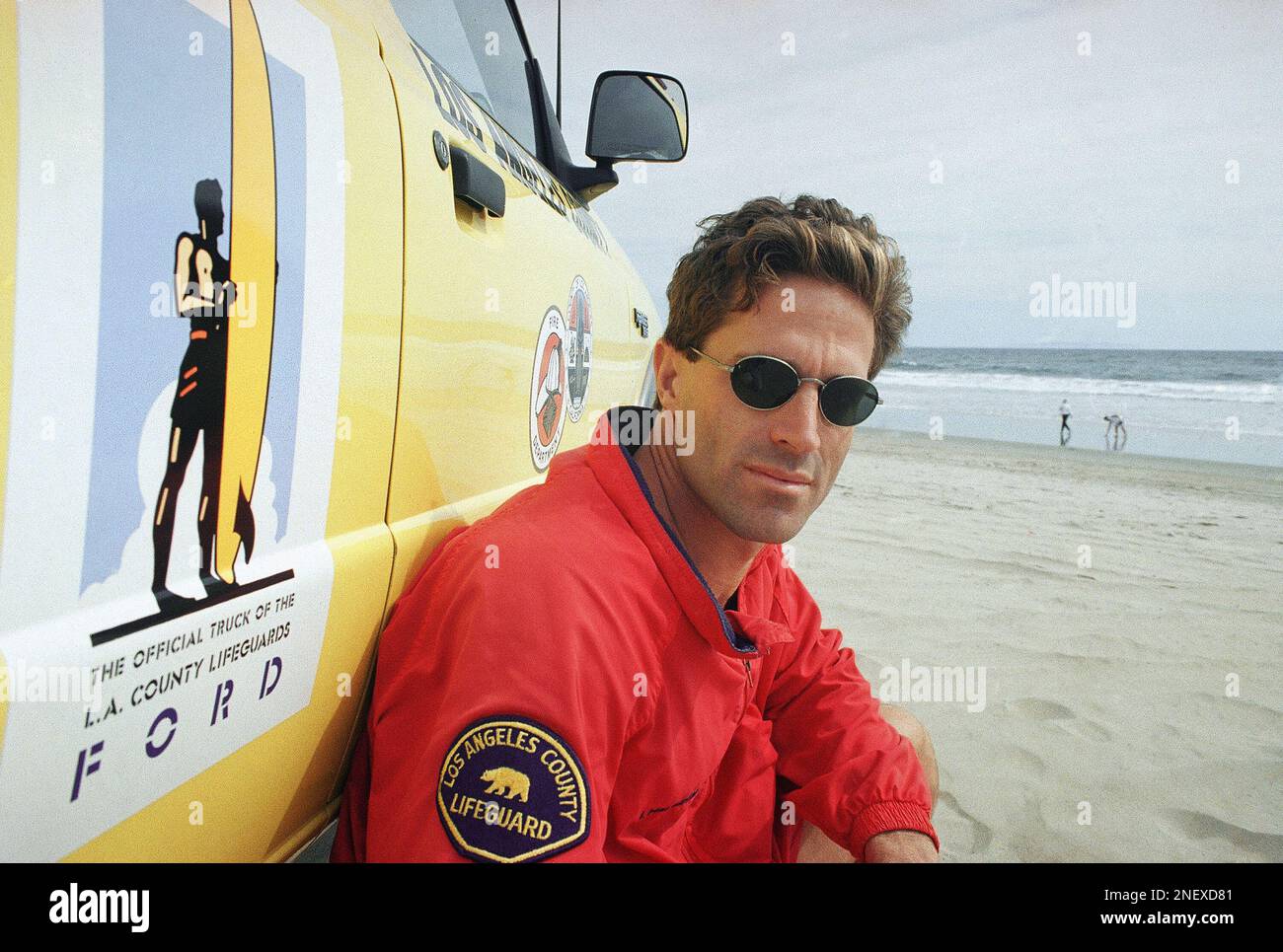 Los Angeles Country Lifeguard Ion Hartunian poses with lifeguard truck ...