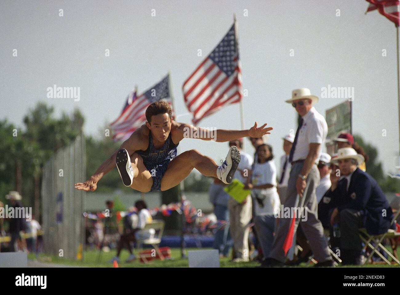 Masaki Morinaga of Japan takes to the air during the long jump ...