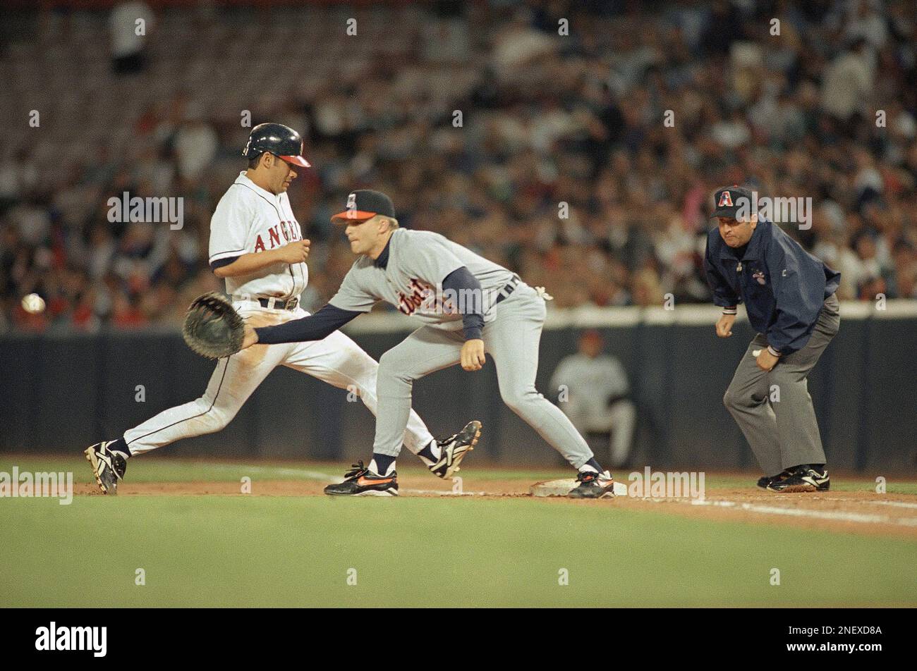 California Angels’ George Arias scoots back to first as Tim Hyers of ...