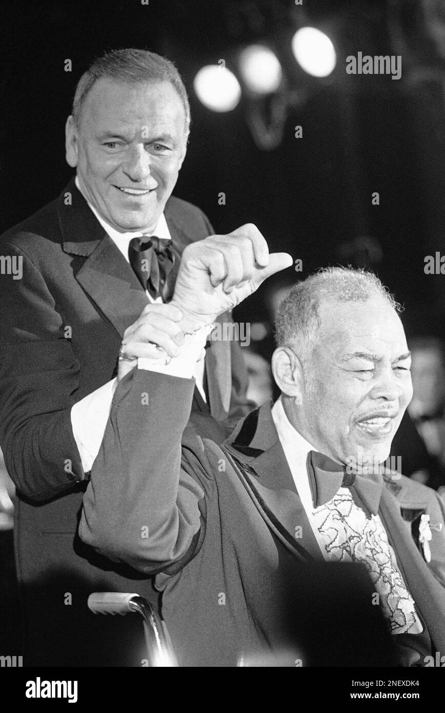 Entertainer Frank Sinatra raises the arm of former great boxing ...