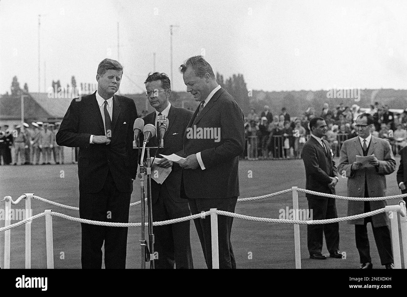 U.S. President John F. Kennedy (left) listens as West Berlin Mayor ...