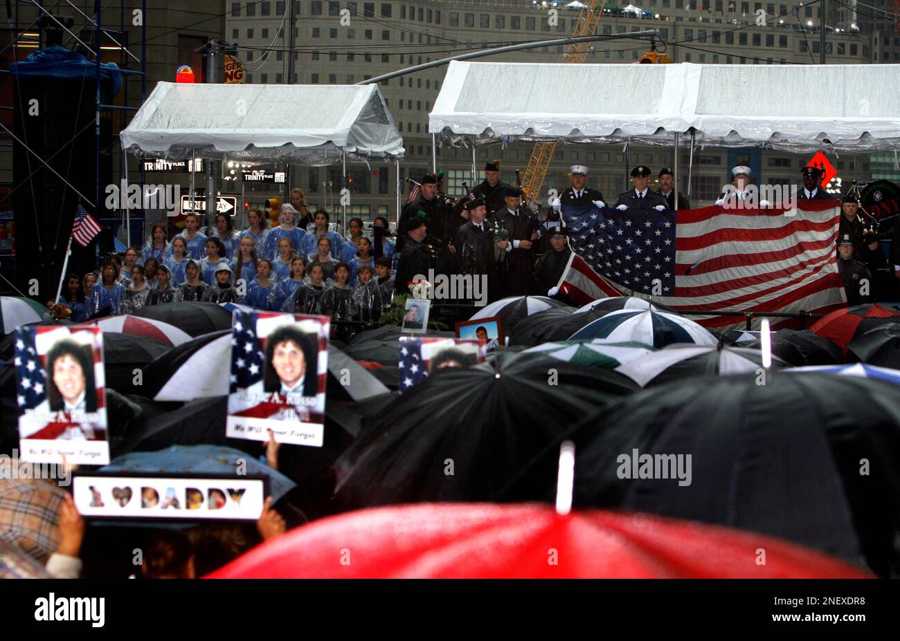 The World Trade Center flag is presented as friends and relatives of ...