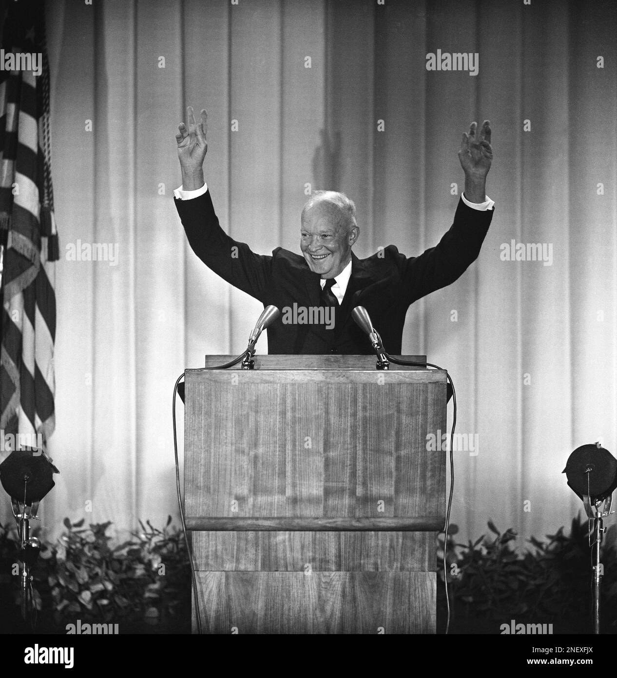 President Dwight Eisenhower has arms extended in wave to crowd inside ...