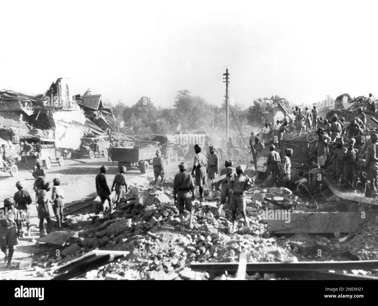 Workmen remove debris of the great earthquake in Quetta, India, May ...