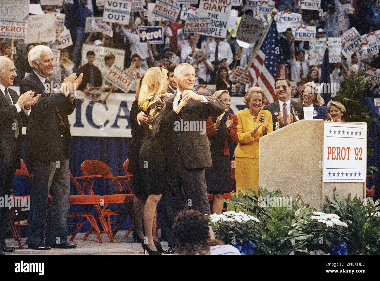 Independent candidate for president Ross Perot dances with his daughter Suzanne McGee during a ...