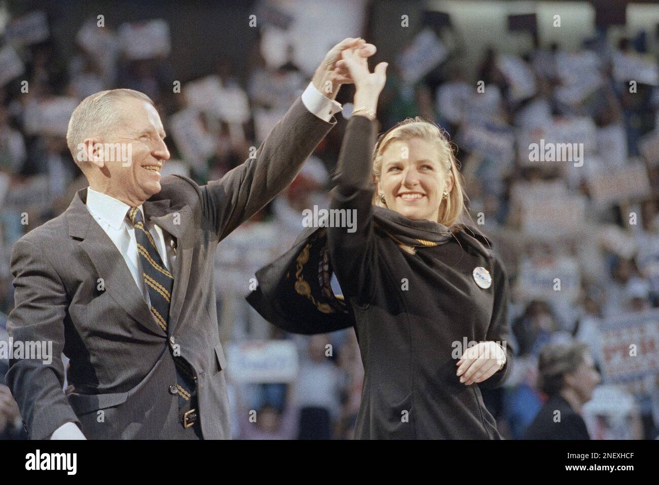 Independent candidate for president Ross Perot dances with his daughter, Suzanne McGee, during a ...