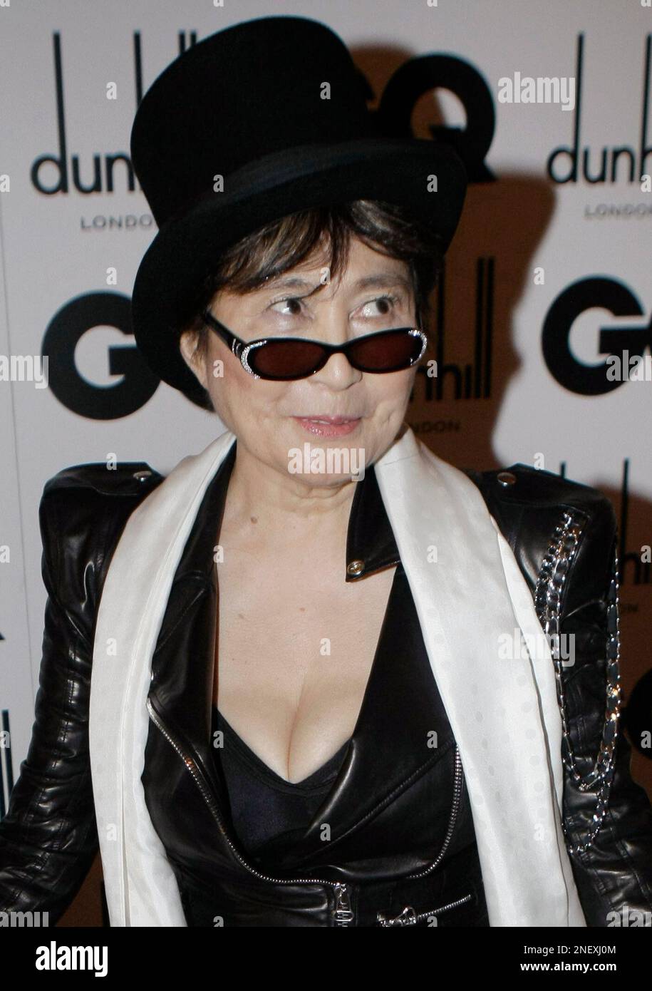 Yoko Ono poses for photographs as she arrives at the 'GQ Men of the ...