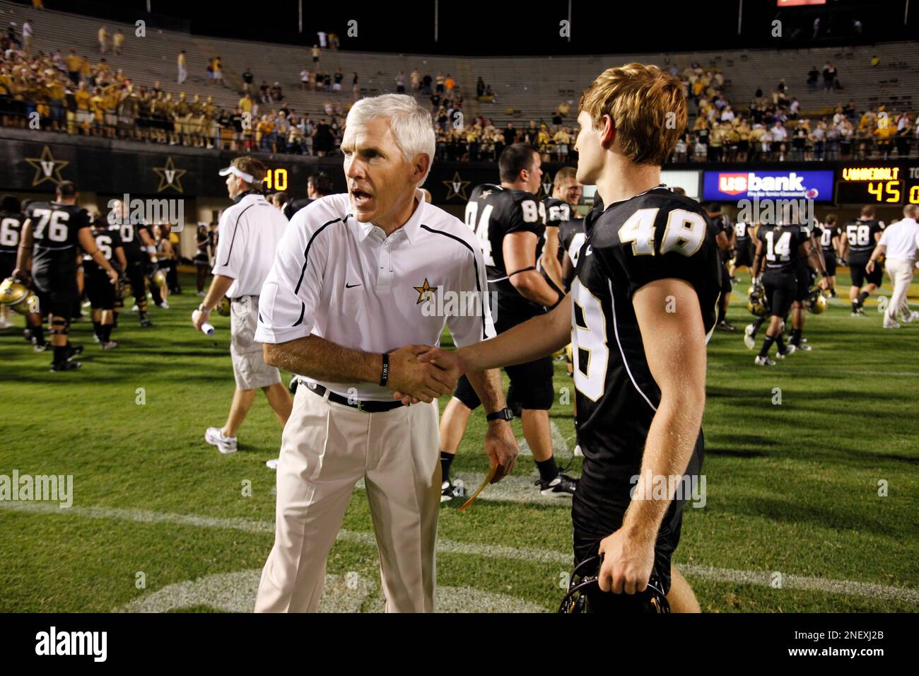 Vanderbilt head football coach Bobby Johnson, left, congratulates ...