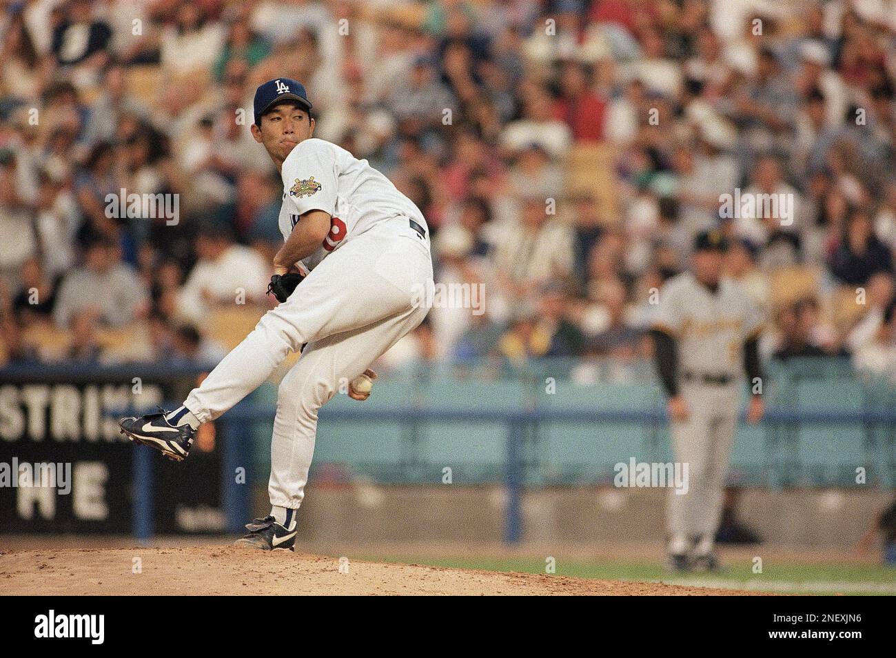 Los Angeles Dodgers pitcher Hideo Nomo lines up a second inning pitch ...