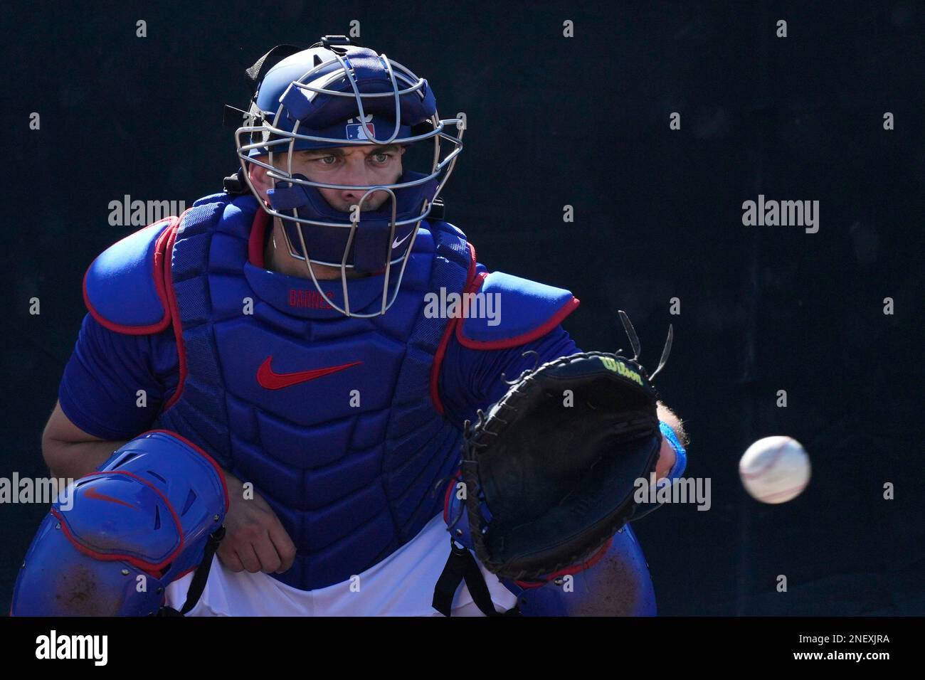 Los Angeles Dodgers catcher Austin Barnes watches the ball head to his ...