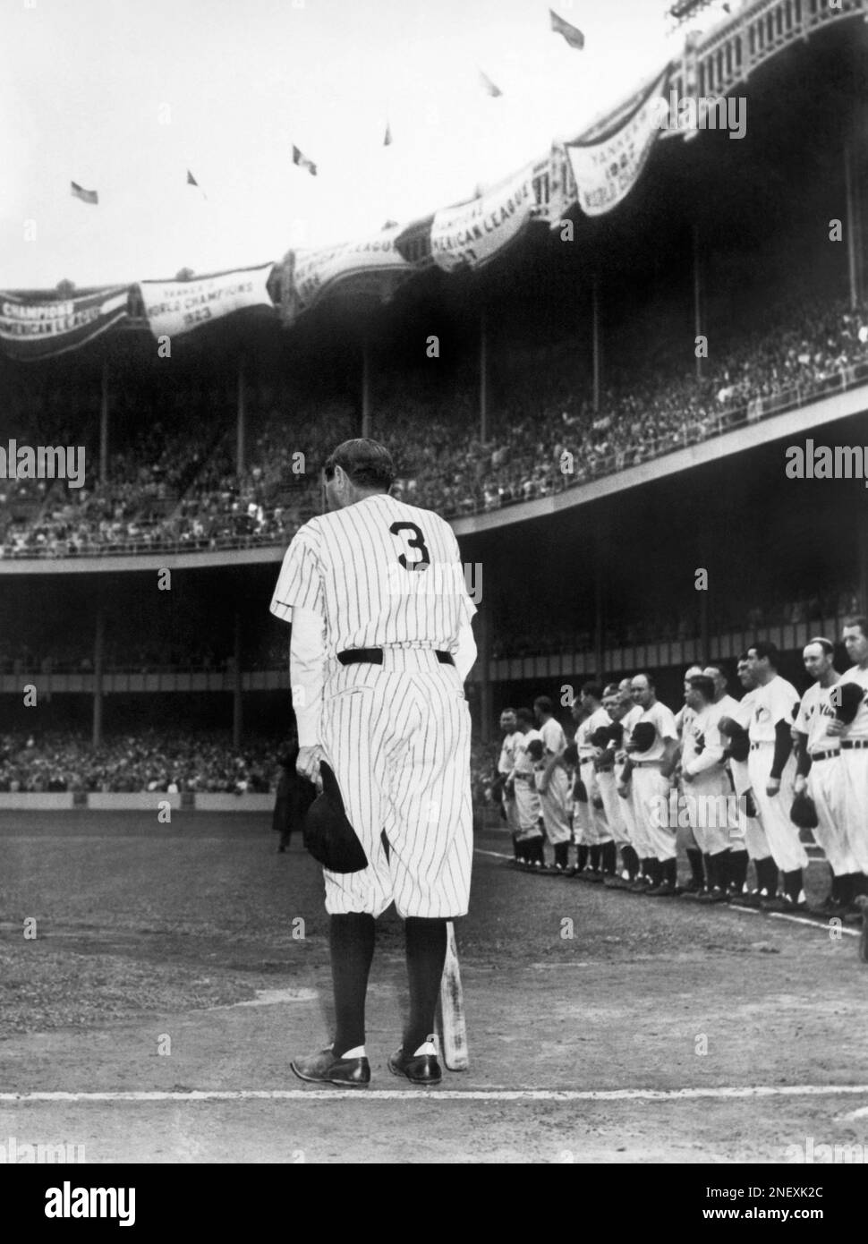 Home run king Babe Ruth, wearing his famed number 3 uniform, bows as he ...