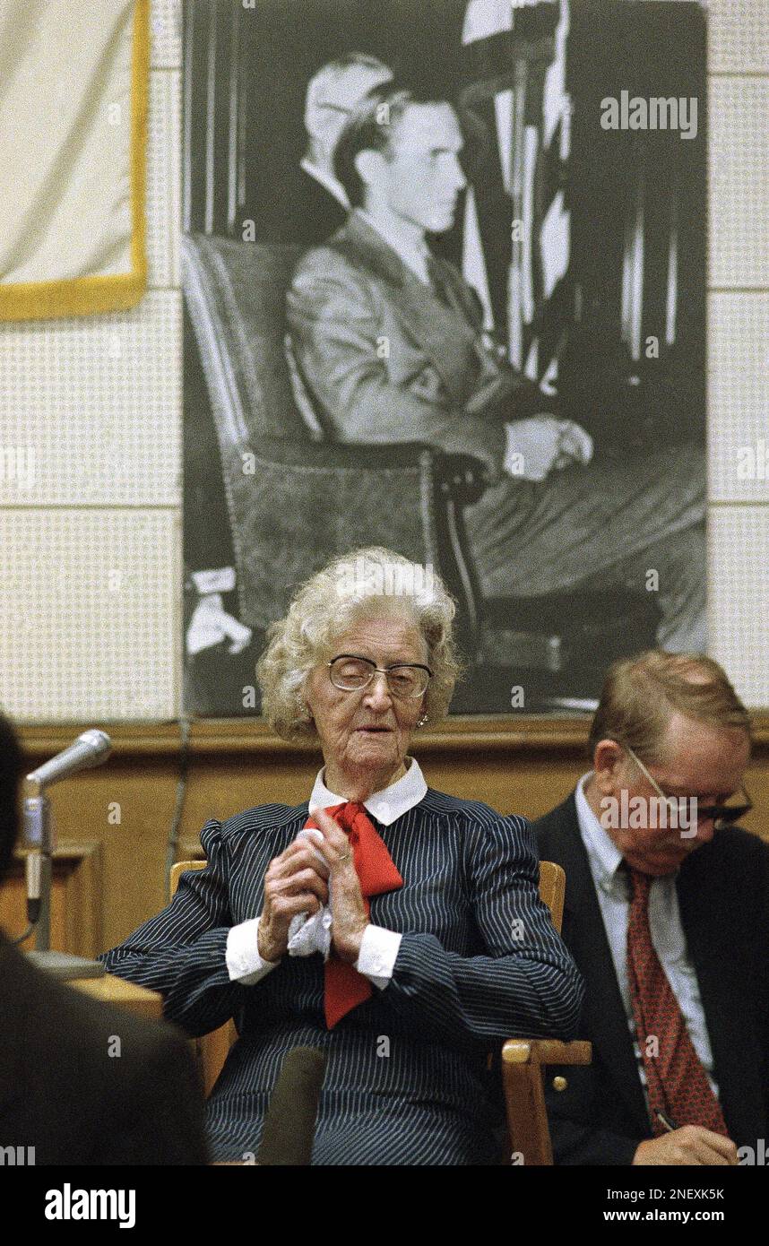 Sitting in front of a photo of her late husband, Bruno Richard ...