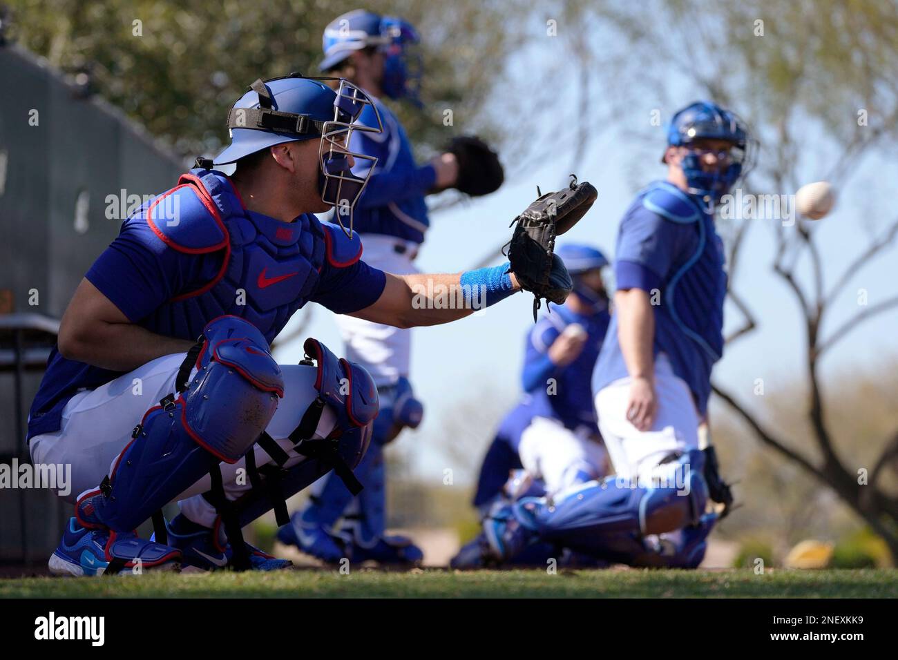 Los Angeles Dodgers catcher Austin Barnes, left, makes a catch on a ...