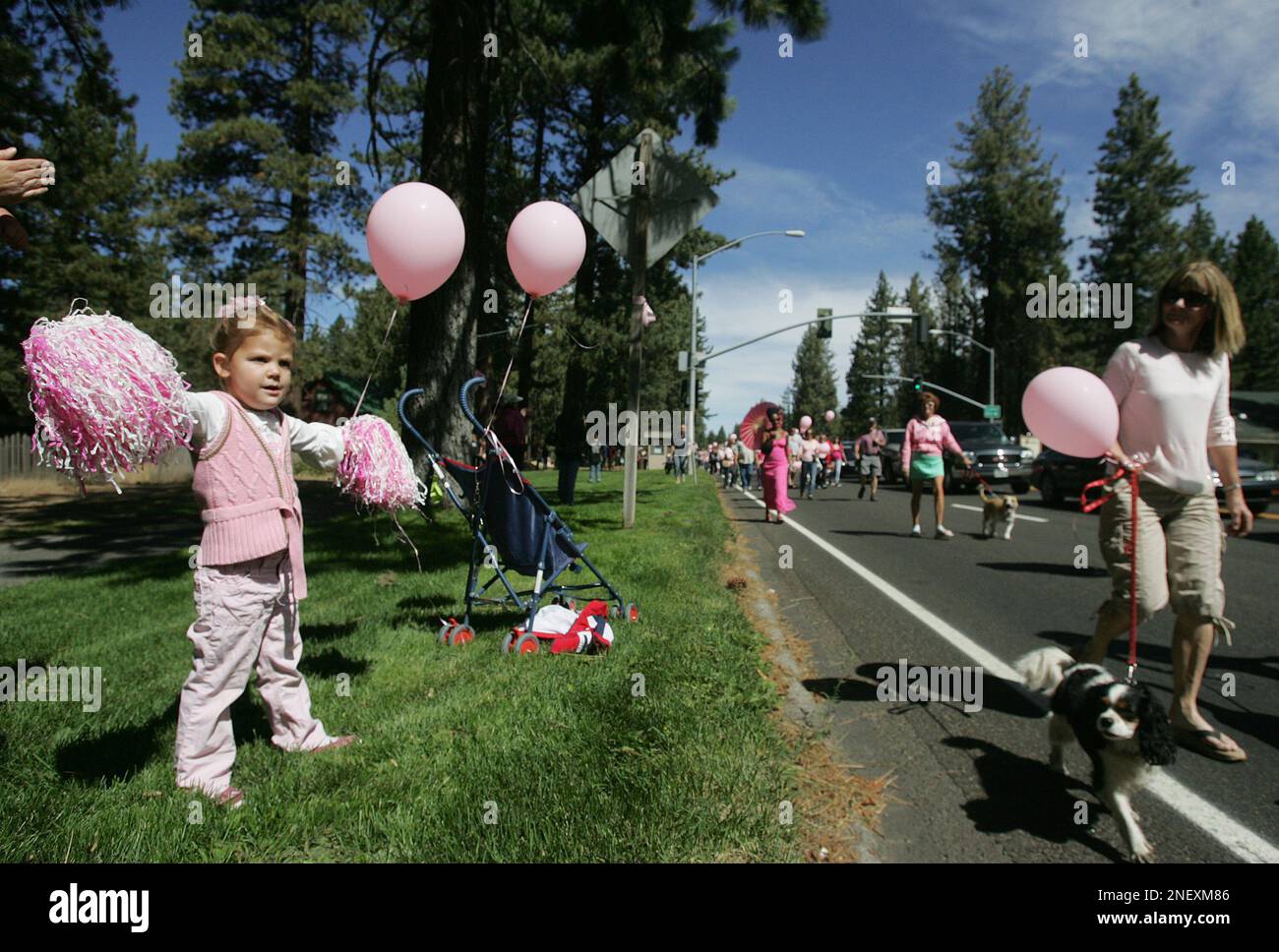 Allana Hernandez, 3, of South Lake Tahoe, Calif., cheers during a ...
