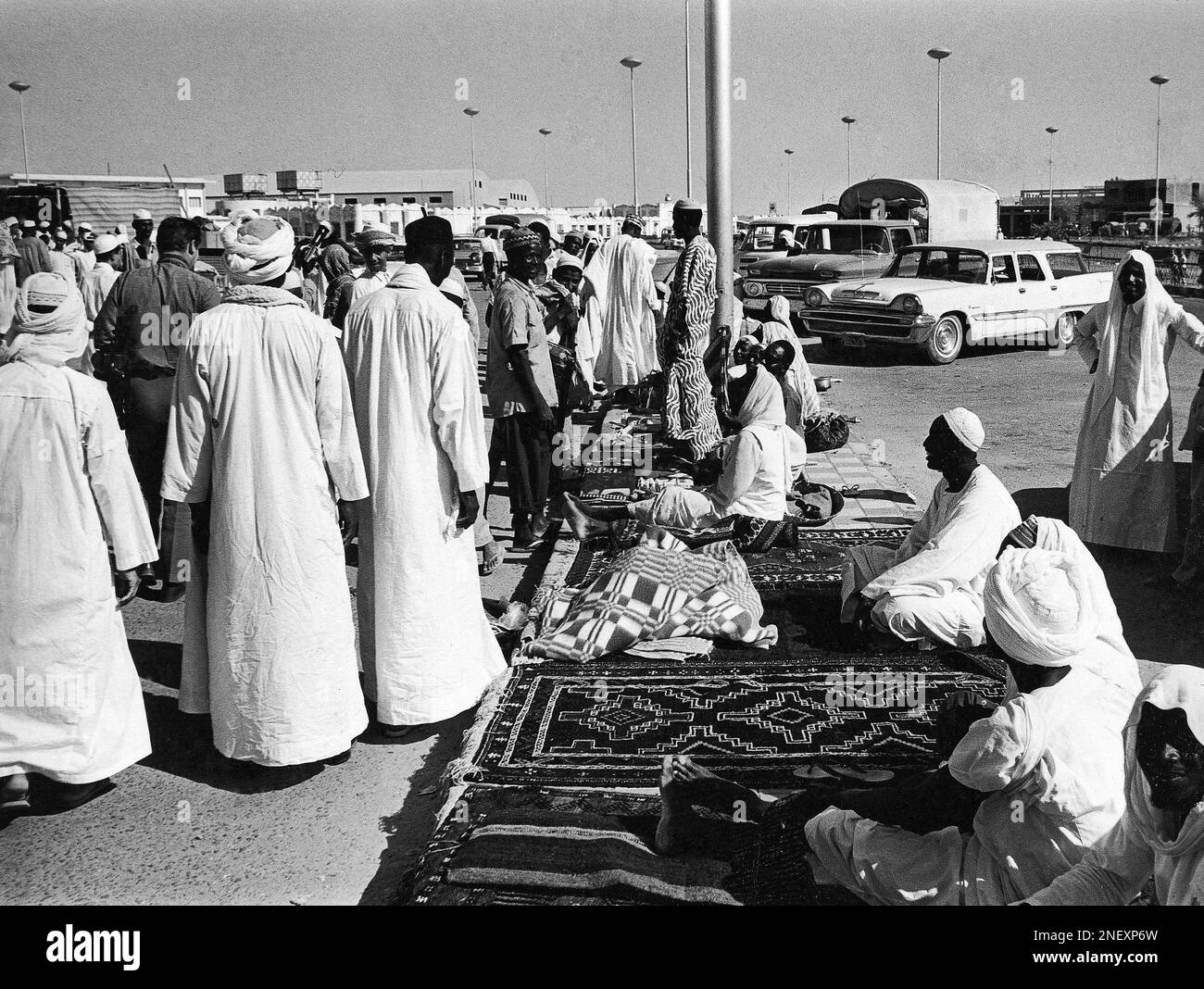 Carpet merchants hawk their wares outside the airport at Jidda as ...