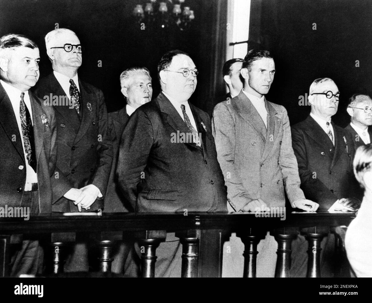 The German carpenter is shown (in gray suit) when he was arraigned in ...
