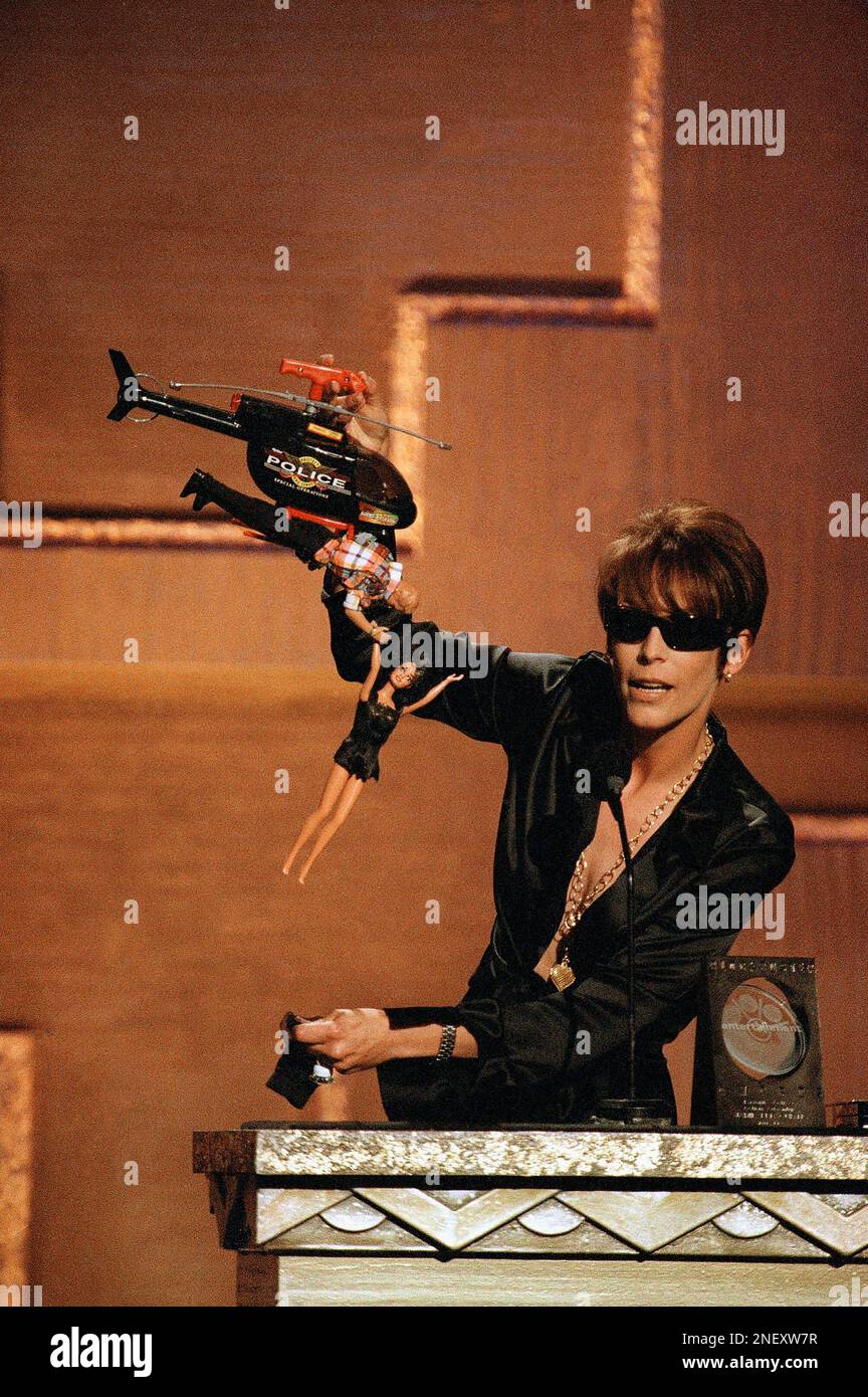 Actress Jamie Lee Curtis displays a toy model of a stunt that was used ...