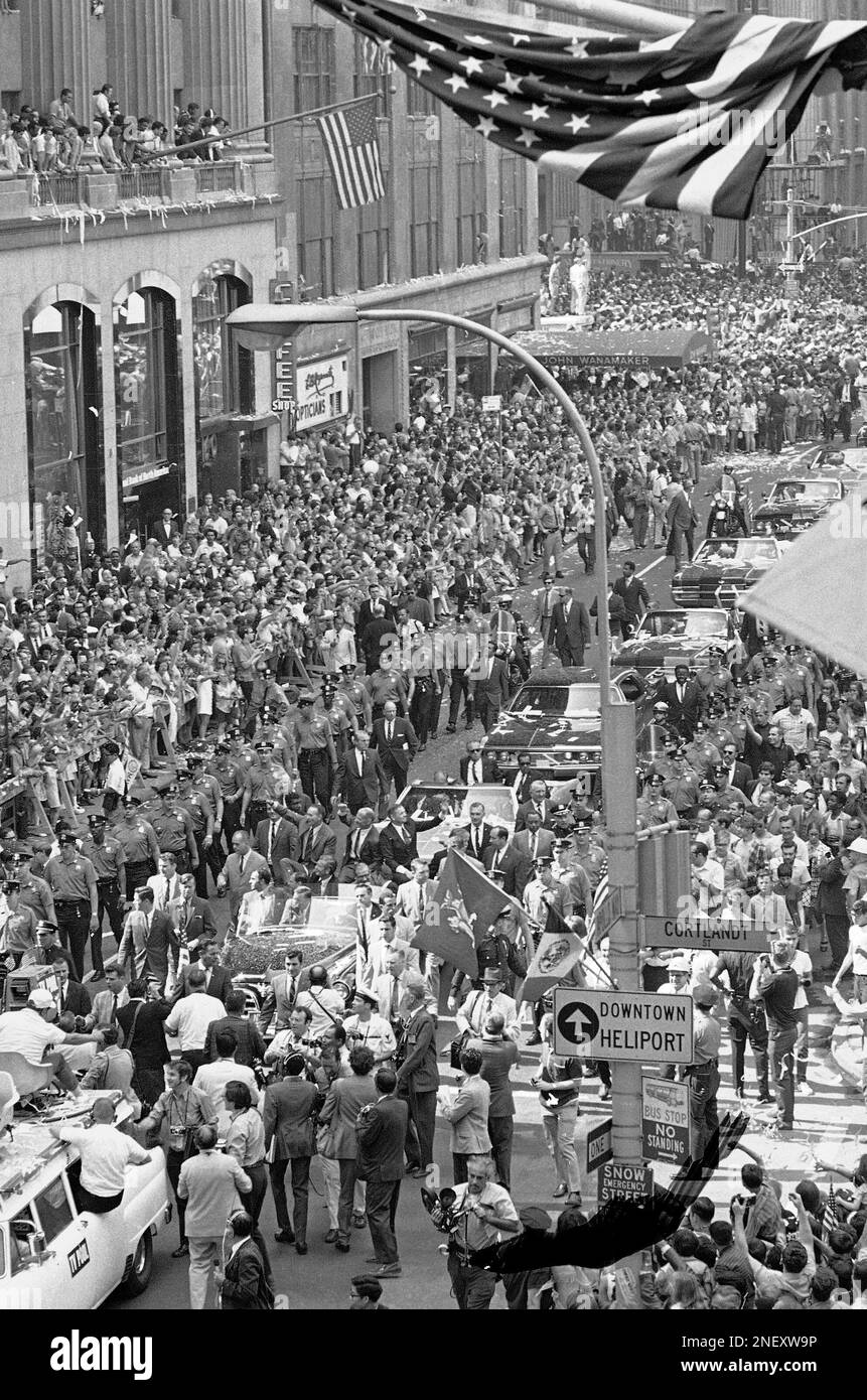 American flags frame the scene as Apollo 11 astronauts wave to the ...