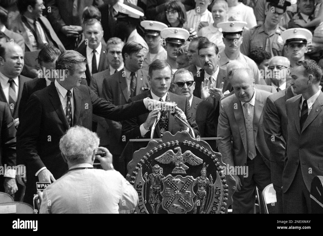 Mayor John Lindsay of New York pushes microphones down so Apollo 11 ...
