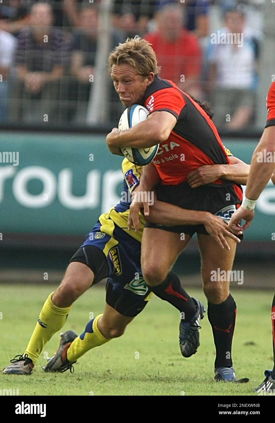 Toulon's British player Jonny Wilkinson, right, is tackled by Clermont ...