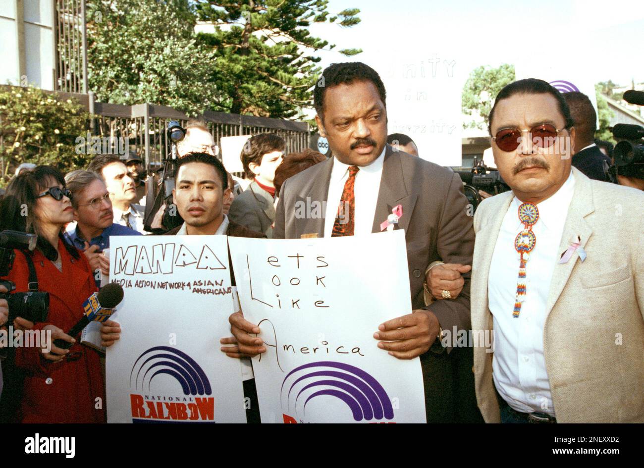 Rev. Jesse Jackson, center, leads the picket line arm-in-arm with Ben ...